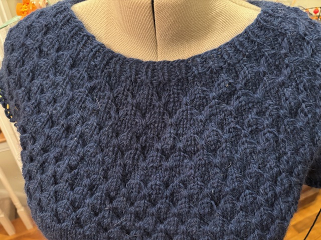 Ethel Models the Cozy Caltha Sweater with Butterfly Stitch